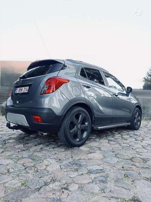 Grey Opel Mokka 2014 in Utena, with an engine capacity of 1.69 L and mileage of 117 thousand km for 11450 €, photo  on AUTOMOTO.COM.LV
