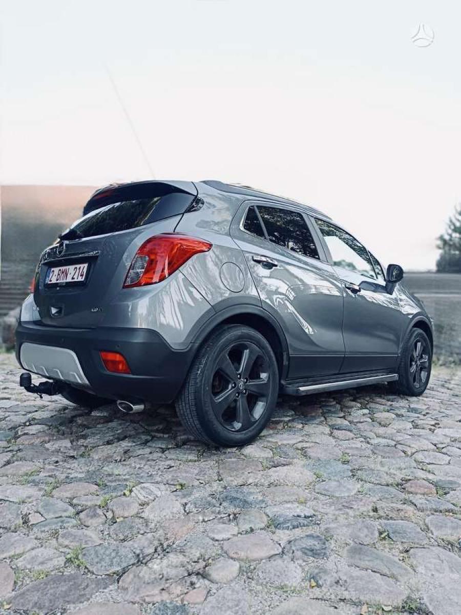 Grey Opel Mokka 2014 in Utena, with an engine capacity of 1.69 L and mileage of 117 thousand km for 11450 €, photo 1 on AUTOMOTO.COM.LV