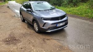 Grey Opel Mokka 2023 in Riga, with an engine capacity of 1.20 L and mileage of 24 thousand km for 13400 €, photo  on AUTOMOTO.COM.LV