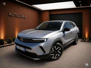 Grey Opel Mokka 2023 in Marijampole, with an engine capacity of 1.20 L and mileage of 24 thousand km for 16577 €, photo  on AUTOMOTO.COM.LV