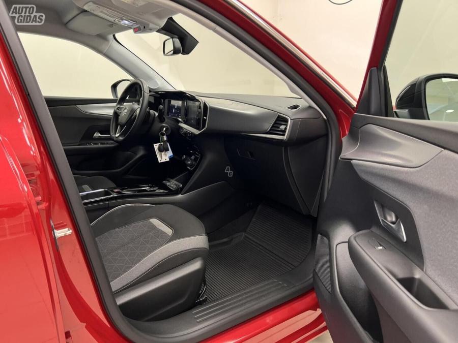 Red Opel Mokka 2021 in Vilnius, with an engine capacity of 1.20 L and mileage of 24 thousand km for 15990 €, photo 18 on AUTOMOTO.COM.LV
