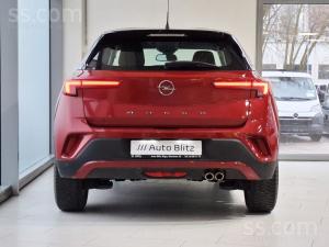 Red Opel Mokka 2023 in Riga, with an engine capacity of 1.20 L and mileage of 60 thousand km for 17500 €, photo 3 on AUTOMOTO.COM.LV