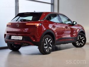 Red Opel Mokka 2023 in Riga, with an engine capacity of 1.20 L and mileage of 59 thousand km for 16250 €, photo 2 on AUTOMOTO.COM.LV
