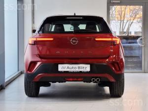 Red Opel Mokka 2023 in Riga, with an engine capacity of 1.20 L and mileage of 59 thousand km for 16250 €, photo 3 on AUTOMOTO.COM.LV