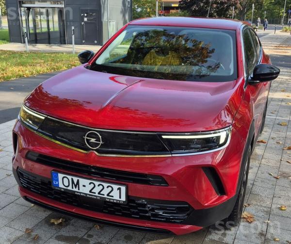 Red Opel Mokka 2023 in Riga, with an engine capacity of 1.20 L and mileage of 65 thousand km for 14000 €, photo 1 on AUTOMOTO.COM.LV