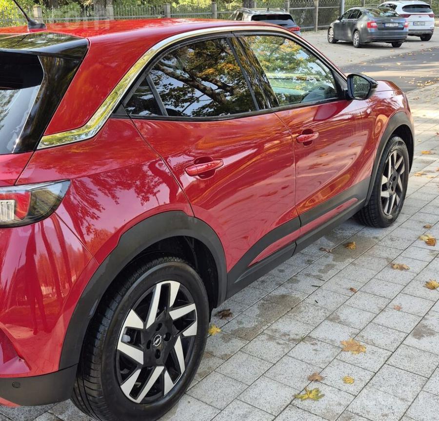 Red Opel Mokka 2023 in Riga, with an engine capacity of 1.20 L and mileage of 65 thousand km for 14000 €, photo 4 on AUTOMOTO.COM.LV