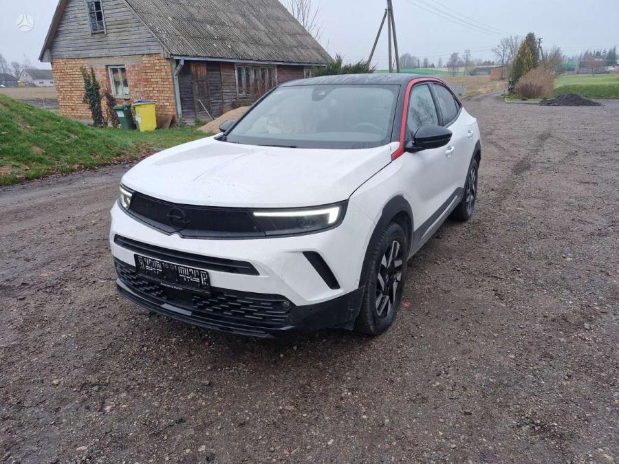 White Opel Mokka 2023 in Marijampole, with an engine capacity of 0.00 L and mileage of 6 thousand km for 12600 €, photo 1 on AUTOMOTO.COM.LV