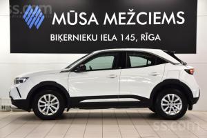 White Opel Mokka 2023 in Riga, with an engine capacity of 1.50 L and mileage of 113 thousand km for 10990 €, photo 6 on AUTOMOTO.COM.LV