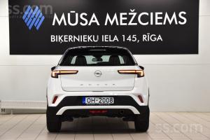 White Opel Mokka 2023 in Riga, with an engine capacity of 1.50 L and mileage of 113 thousand km for 10990 €, photo 8 on AUTOMOTO.COM.LV