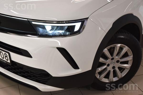 White Opel Mokka 2023 in Riga, with an engine capacity of 1.50 L and mileage of 113 thousand km for 10990 €, photo 10 on AUTOMOTO.COM.LV