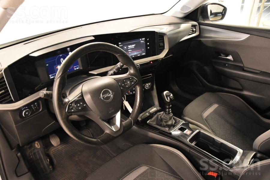 White Opel Mokka 2023 in Riga, with an engine capacity of 1.50 L and mileage of 113 thousand km for 10990 €, photo 13 on AUTOMOTO.COM.LV