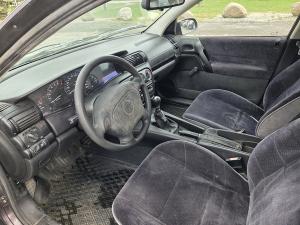 Red Opel Omega 1994 in Tallinn, with an engine capacity of 2.00 L and mileage of 256 thousand km for 500 €, photo 5 on AUTOMOTO.COM.LV