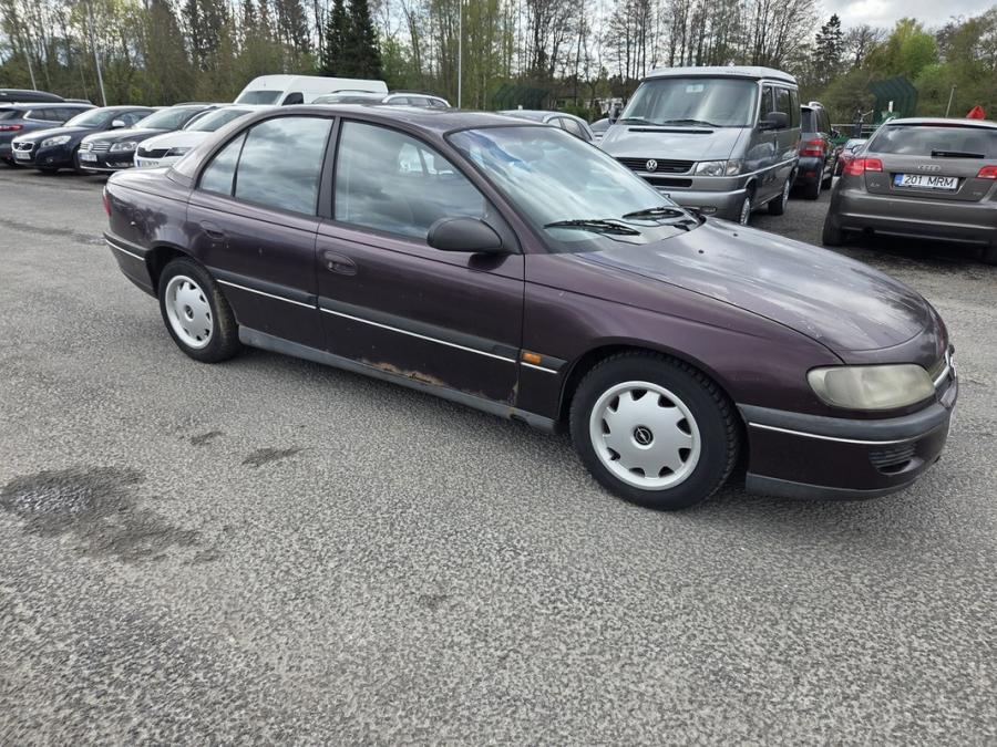 Red Opel Omega 1994 in Tallinn, with an engine capacity of 2.00 L and mileage of 256 thousand km for 500 €, photo 6 on AUTOMOTO.COM.LV