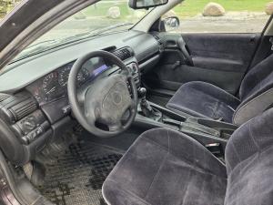 Red Opel Omega 1994 in Tallinn, with an engine capacity of 2.00 L and mileage of 256 thousand km for 500 €, photo 9 on AUTOMOTO.COM.LV