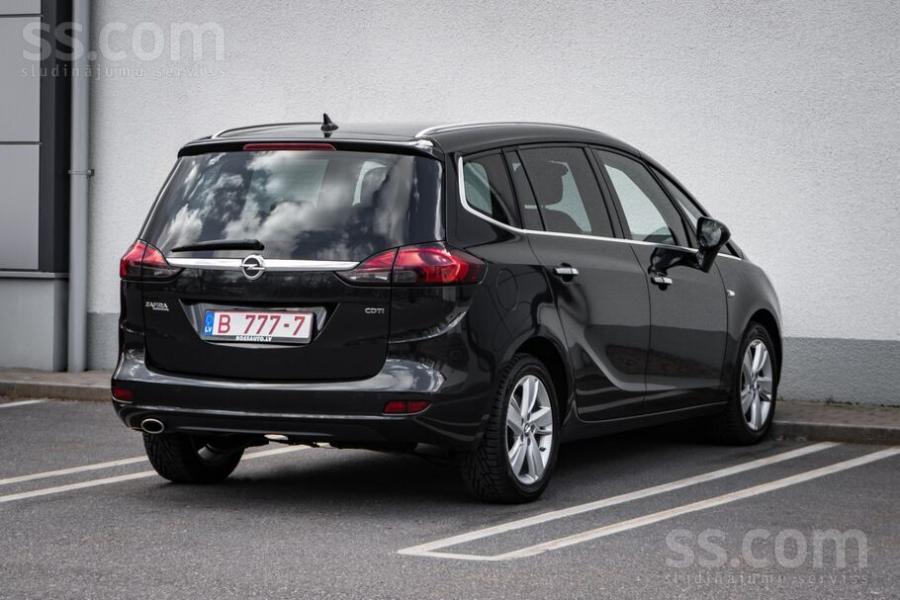 Black Opel Zafira 2013 in Riga, with an engine capacity of 2.00 L and mileage of 236 thousand km for 5950 €, photo 5 on AUTOMOTO.COM.LV
