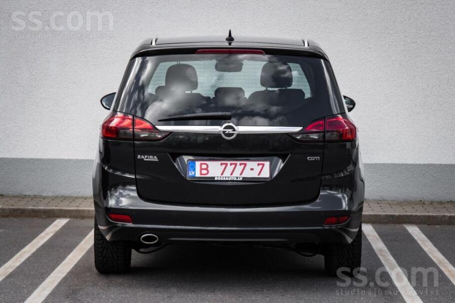 Black Opel Zafira 2013 in Riga, with an engine capacity of 2.00 L and mileage of 236 thousand km for 5950 €, photo 6 on AUTOMOTO.COM.LV