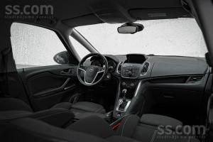 Black Opel Zafira 2013 in Riga, with an engine capacity of 2.00 L and mileage of 236 thousand km for 5950 €, photo 16 on AUTOMOTO.COM.LV
