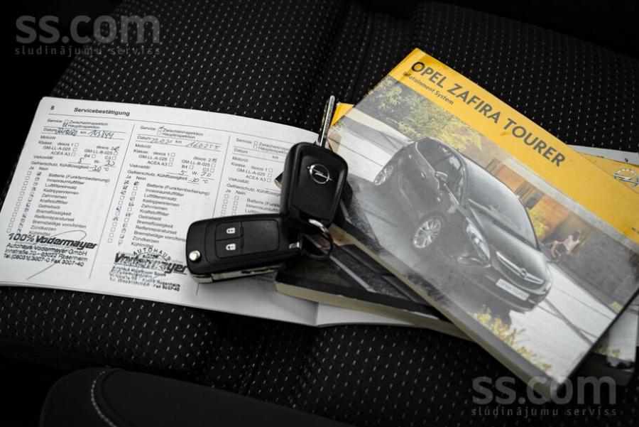 Black Opel Zafira 2013 in Riga, with an engine capacity of 2.00 L and mileage of 236 thousand km for 5950 €, photo 30 on AUTOMOTO.COM.LV