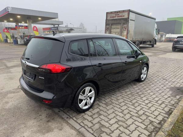 Black Opel Zafira Tourer 2015 in Kaunas, with an engine capacity of 1.96 L and mileage of 166 thousand km for 6350 €, photo 6 on AUTOMOTO.COM.LV