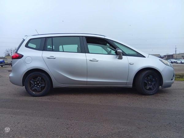 Grey Opel Zafira Tourer 2014 in Kaunas, with an engine capacity of 1.96 L and mileage of 174 thousand km for 2250 €, photo 7 on AUTOMOTO.COM.LV