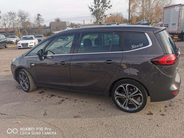 Grey Opel Zafira Tourer 2015 in Prienai, with an engine capacity of 1.60 L and mileage of 286 thousand km for 5799 €, photo 10 on AUTOMOTO.COM.LV