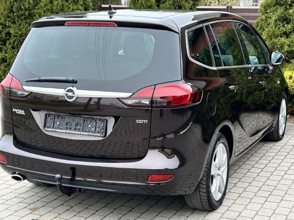 Violet Opel Zafira Tourer 2012 in Kretinga, with an engine capacity of 2.00 L and mileage of 250 thousand km for 6150 €, photo 11 on AUTOMOTO.COM.LV