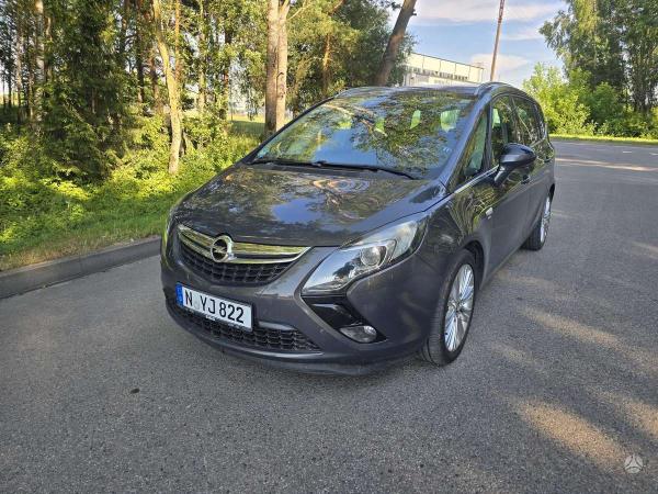 Violet Opel Zafira Tourer 2012 in Ukmerge, with an engine capacity of 1.96 L and mileage of 305 thousand km for 3950 €, photo 1 on AUTOMOTO.COM.LV