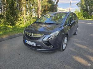 Violet Opel Zafira Tourer 2012 in Ukmerge, with an engine capacity of 1.96 L and mileage of 305 thousand km for 3950 €, photo  on AUTOMOTO.COM.LV