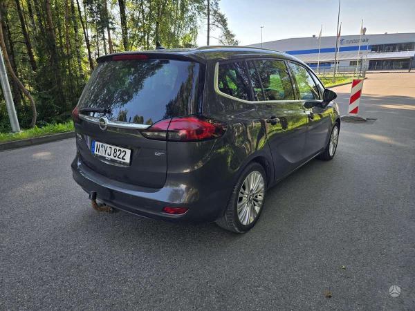 Violet Opel Zafira Tourer 2012 in Ukmerge, with an engine capacity of 1.96 L and mileage of 305 thousand km for 3950 €, photo 5 on AUTOMOTO.COM.LV