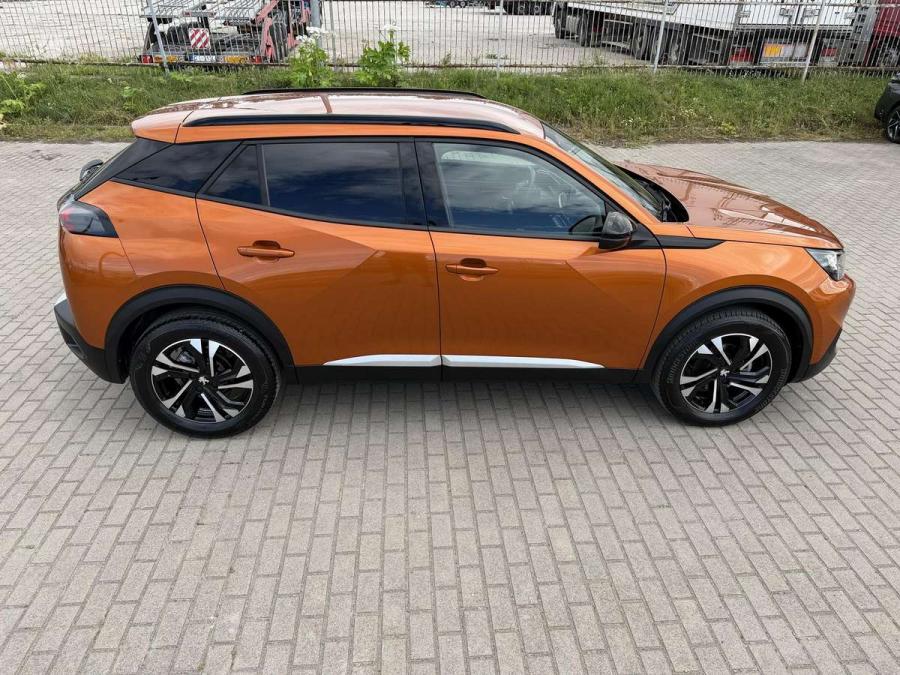 Orange Peugeot 2008 2022 in Marijampole, with an engine capacity of 1.20 L and mileage of 63 thousand km for 13552 €, photo 9 on AUTOMOTO.COM.LV