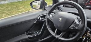 Black Peugeot 208 2012 in Kaunas, with an engine capacity of 1.40 L and mileage of 238 thousand km for 2150 €, photo 12 on AUTOMOTO.COM.LV