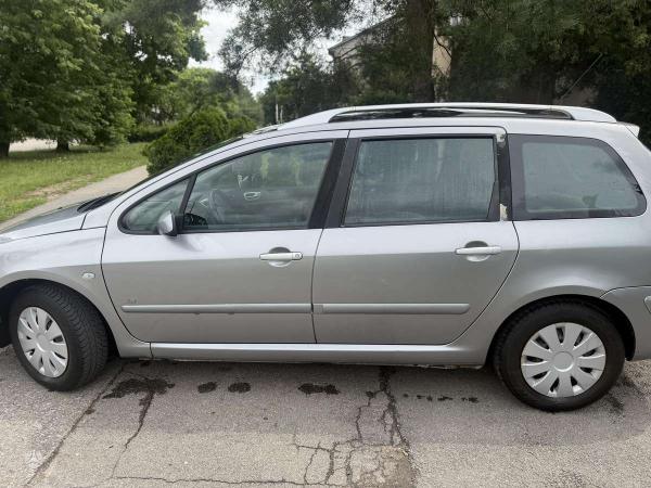 Grey Peugeot 307 2005 in Kaunas, with an engine capacity of 1.56 L and mileage of 242 thousand km for 750 €, photo 9 on AUTOMOTO.COM.LV