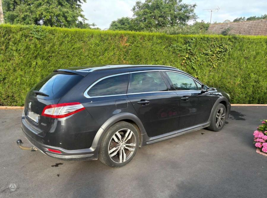 Black Peugeot 508 RXH 2016 in Taurage, with an engine capacity of 2.00 L and mileage of 239 thousand km for 5500 €, photo 6 on AUTOMOTO.COM.LV