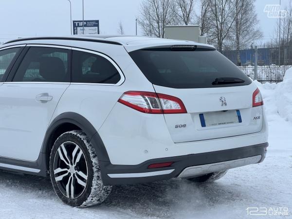 White Peugeot 508 RXH 2015 in Taurage, with an engine capacity of 2.00 L and mileage of 236 thousand km for 7999 €, photo 9 on AUTOMOTO.COM.LV