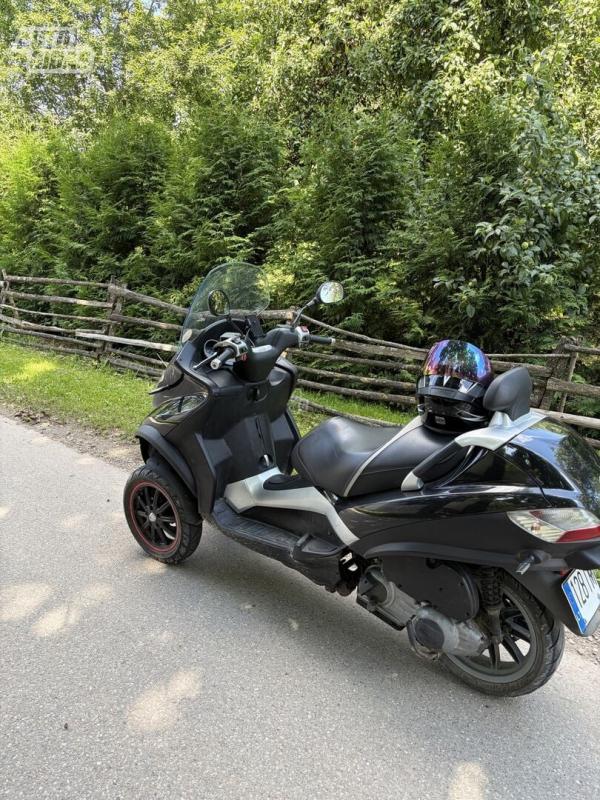 Melns Piaggio MP3 2009 Viļņa, ar dzinēja tilpumu 0.25 L un nobraukumu 38 tūkst. km par 1400 €, foto 6 vietnē AUTOMOTO.COM.LV