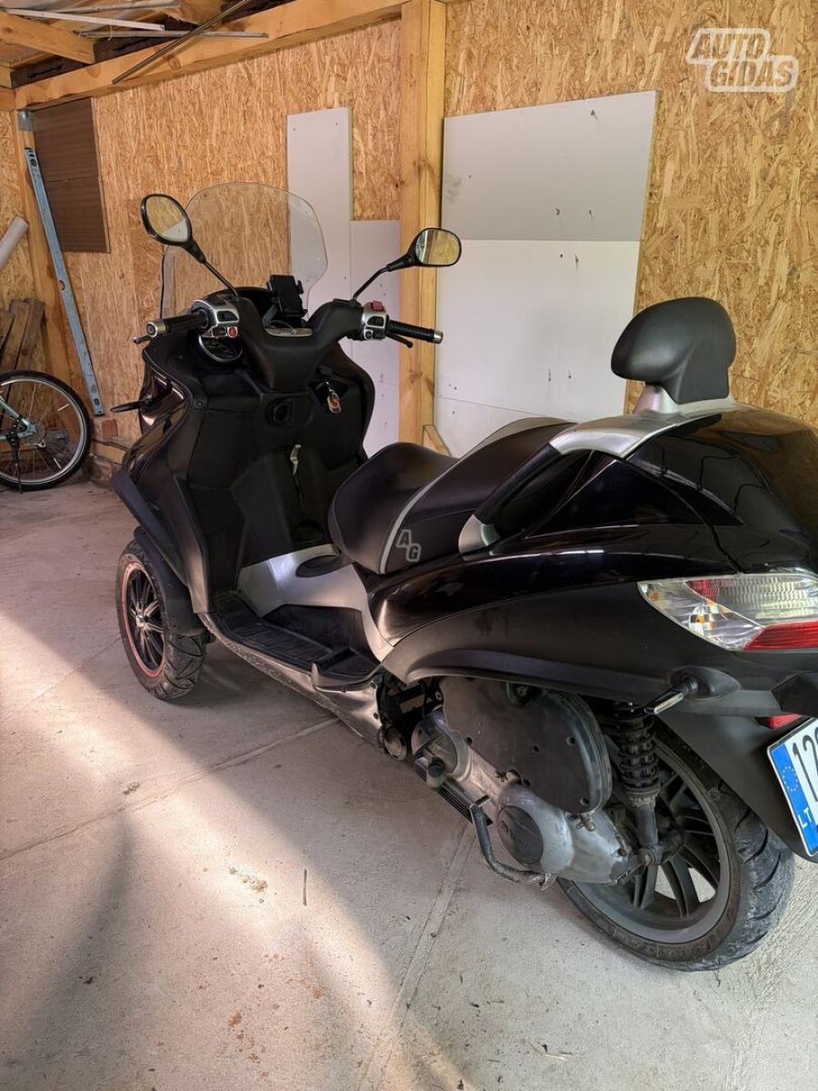 Black Piaggio MP3 2009 in Vilnius, with an engine capacity of 0.25 L and mileage of 38 thousand km for 1400 €, photo 9 on AUTOMOTO.COM.LV