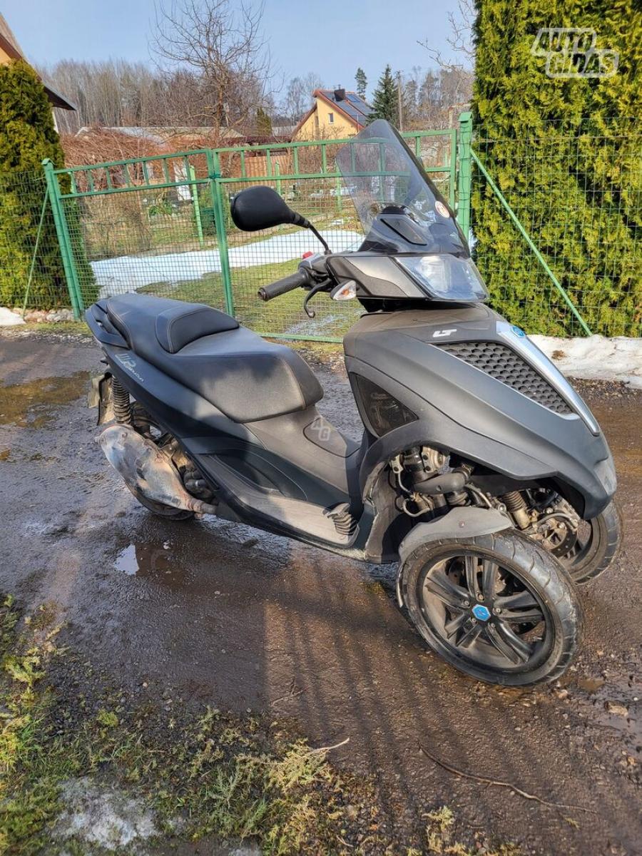 Black Piaggio MP3 2018 in Klaipeda, with an engine capacity of 0.30 L and mileage of 0 thousand km for 2250 €, photo 1 on AUTOMOTO.COM.LV