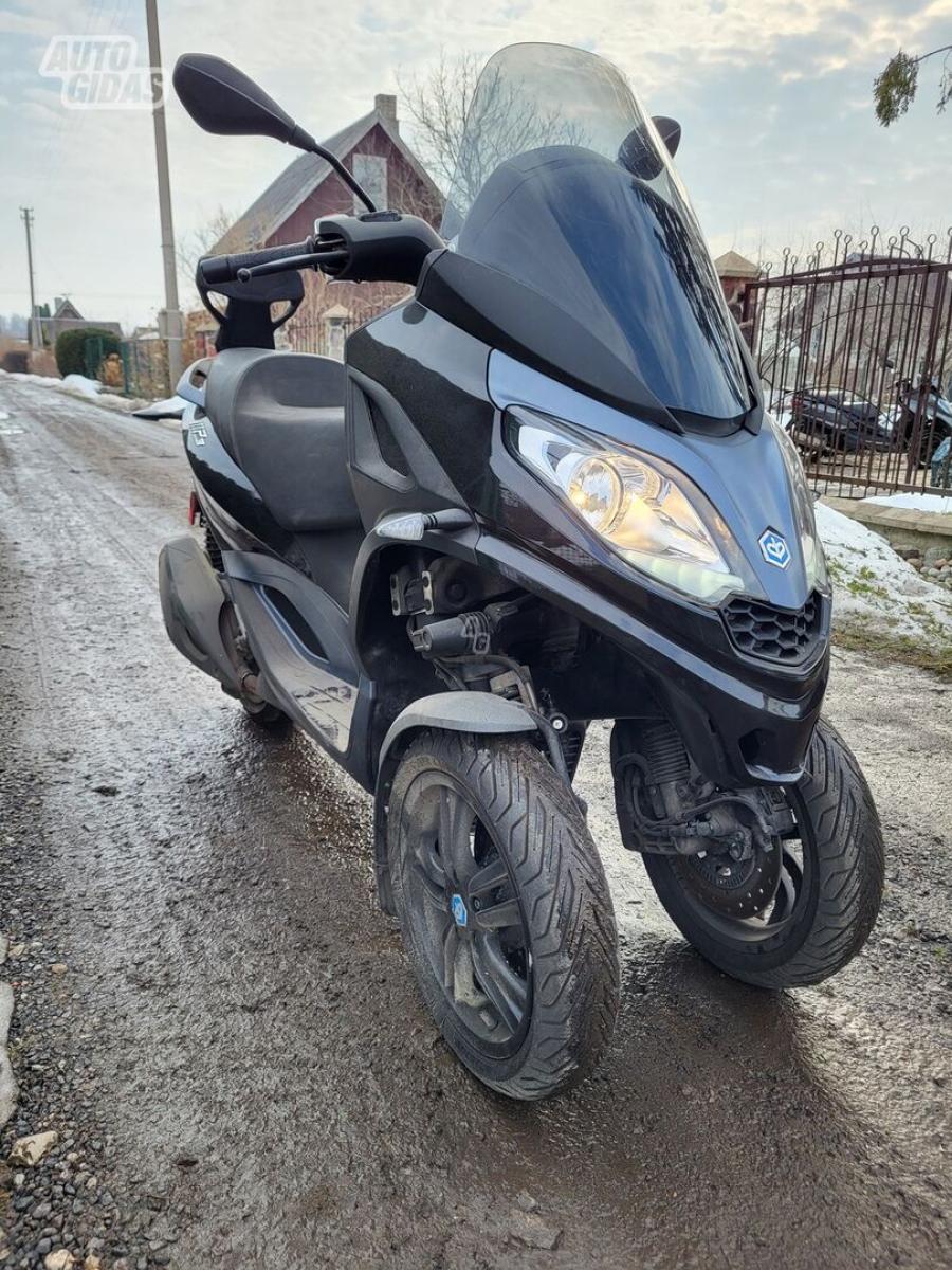 Black Piaggio MP3 2020 in Klaipeda, with an engine capacity of 0.30 L and mileage of 0 thousand km for 3150 €, photo 1 on AUTOMOTO.COM.LV