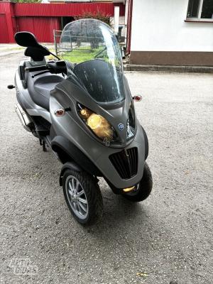 Pelēks Piaggio MP3 2009 Ariogala, ar dzinēja tilpumu 0.40 L un nobraukumu 28 tūkst. km par 1850 €, foto 8 vietnē AUTOMOTO.COM.LV