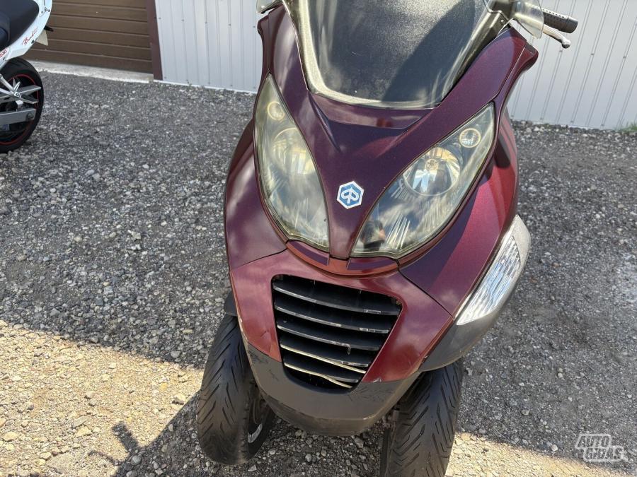 Piaggio MP3 2007 Kelmė, ar dzinēja tilpumu 0.13 L un nobraukumu 33 tūkst. km par 515 €, foto 9 vietnē AUTOMOTO.COM.LV