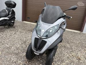 Piaggio MP3 2009 Kelmė, ar dzinēja tilpumu 0.40 L un nobraukumu 36 tūkst. km par 1130 €, foto 8 vietnē AUTOMOTO.COM.LV