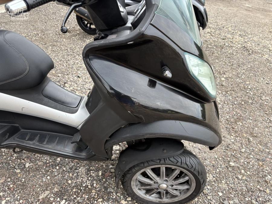 Piaggio MP3 2010 Kelmė, ar dzinēja tilpumu 0.40 L un nobraukumu 37 tūkst. km par 1030 €, foto 14 vietnē AUTOMOTO.COM.LV