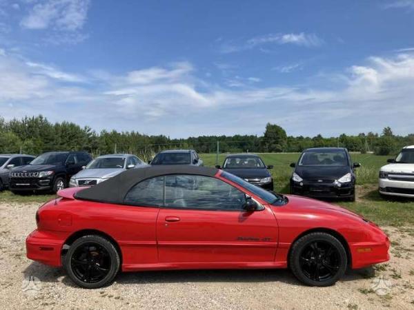 Red Pontiac Sunfire 2000 in Prienai, with an engine capacity of 2.39 L and mileage of 128 thousand km for 3999 €, photo 2 on AUTOMOTO.COM.LV