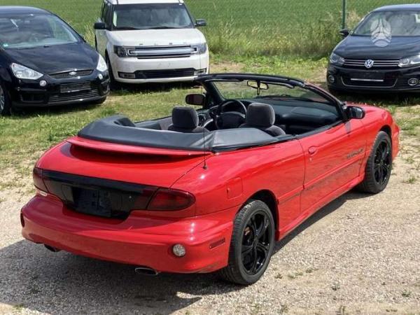 Red Pontiac Sunfire 2000 in Prienai, with an engine capacity of 2.39 L and mileage of 128 thousand km for 3999 €, photo 7 on AUTOMOTO.COM.LV