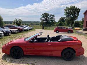 Red Pontiac Sunfire 2000 in Prienai, with an engine capacity of 2.39 L and mileage of 128 thousand km for 3999 €, photo 10 on AUTOMOTO.COM.LV
