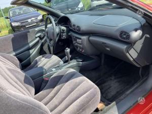 Red Pontiac Sunfire 2000 in Prienai, with an engine capacity of 2.39 L and mileage of 128 thousand km for 3999 €, photo 12 on AUTOMOTO.COM.LV