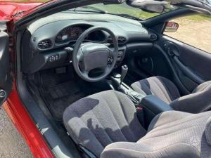 Red Pontiac Sunfire 2000 in Prienai, with an engine capacity of 2.39 L and mileage of 128 thousand km for 3999 €, photo 14 on AUTOMOTO.COM.LV