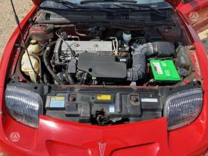 Red Pontiac Sunfire 2000 in Prienai, with an engine capacity of 2.39 L and mileage of 128 thousand km for 3999 €, photo 20 on AUTOMOTO.COM.LV