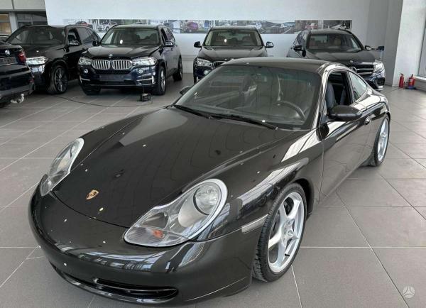 Black Porsche 911 1999 in Marijampole, with an engine capacity of 3.39 L and mileage of 106 thousand km for 29999 €, photo 1 on AUTOMOTO.COM.LV