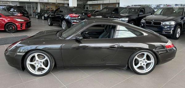 Black Porsche 911 1999 in Marijampole, with an engine capacity of 3.39 L and mileage of 106 thousand km for 29999 €, photo 2 on AUTOMOTO.COM.LV